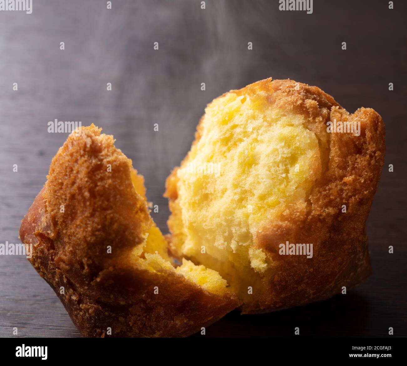 Okinawa's Okinawan Saatha andagi, split in half, which is steamy Stock ...