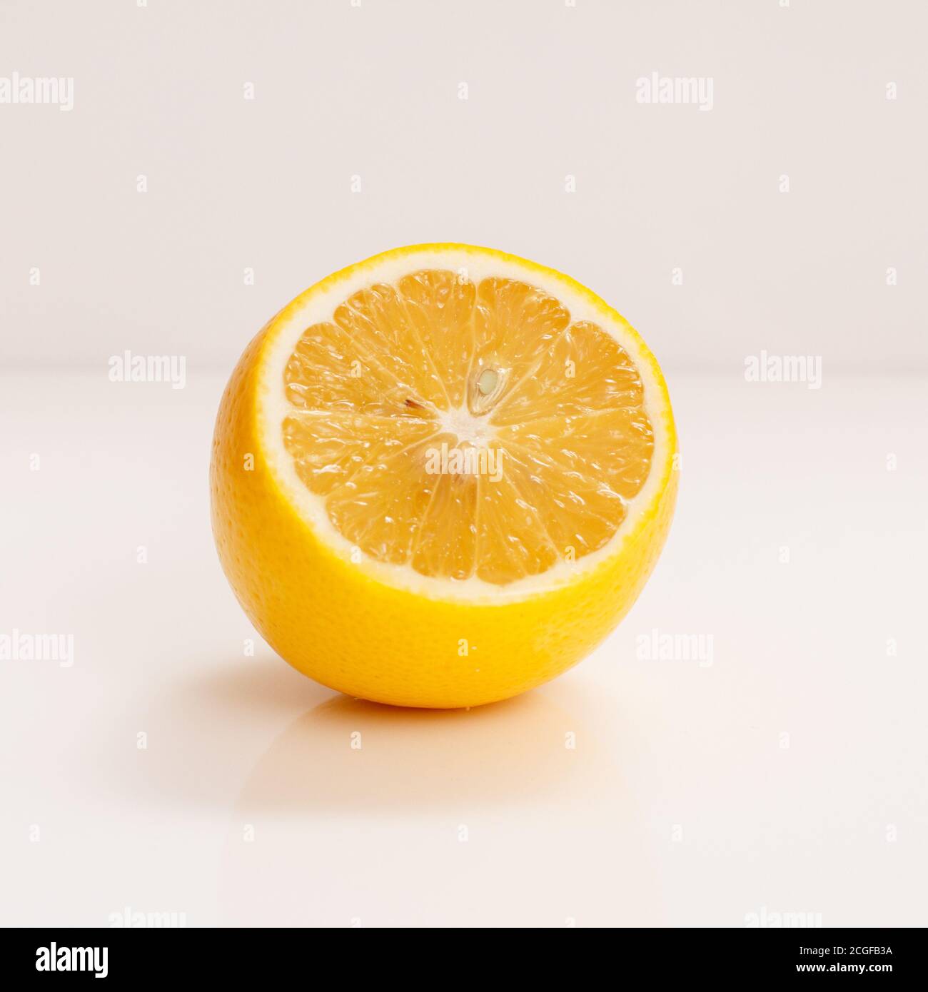 Juicy fresh cut lemon on the white background Stock Photo - Alamy