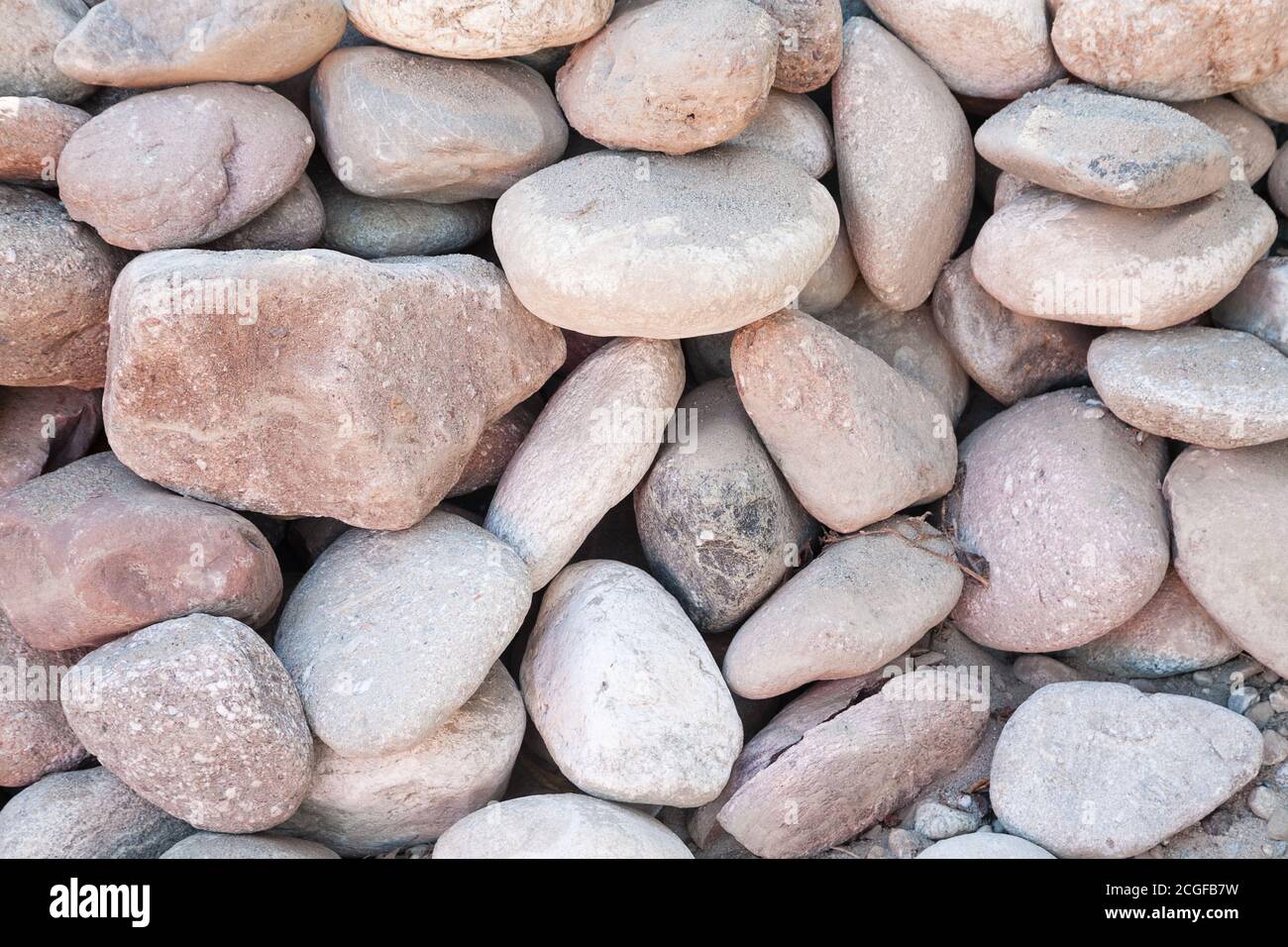Closeup of pile of huge round rocks Stock Photo - Alamy