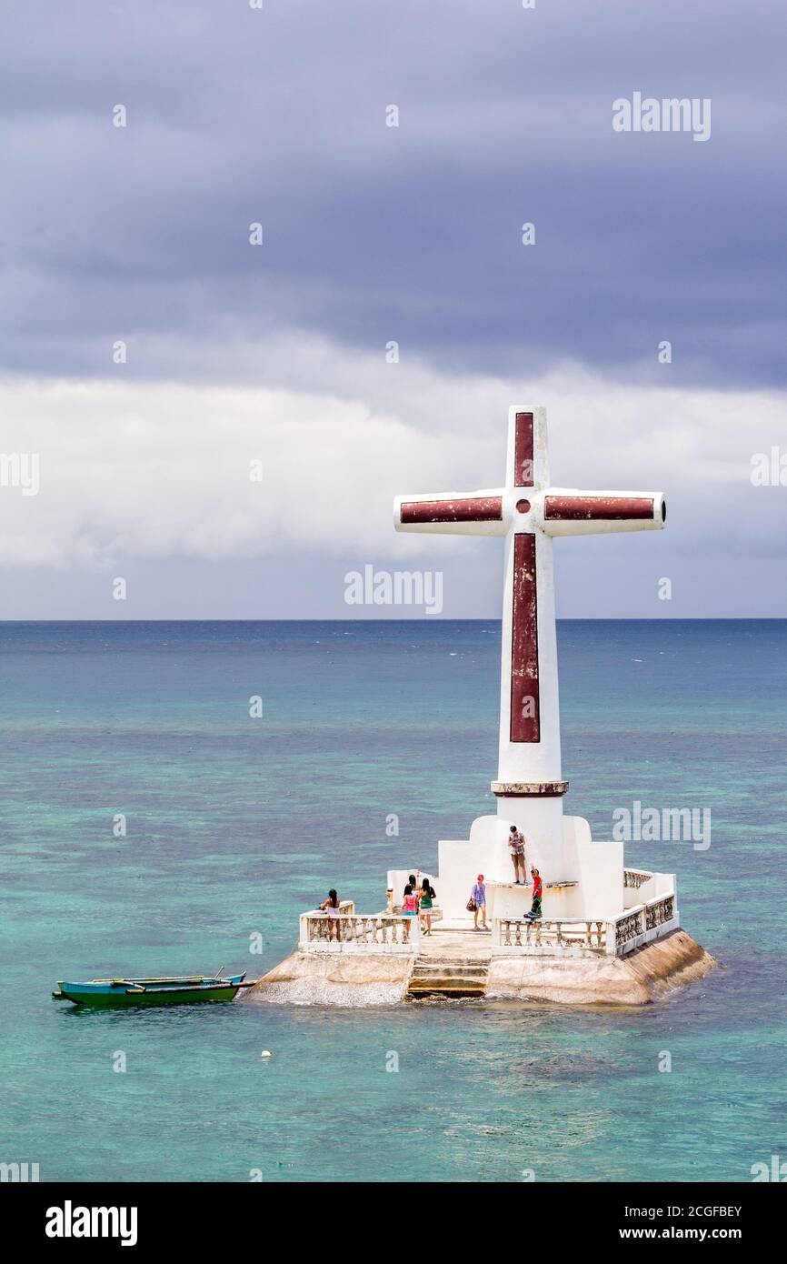A giant cross marks the sunken cemetery off Camiguin Island Stock Photo ...