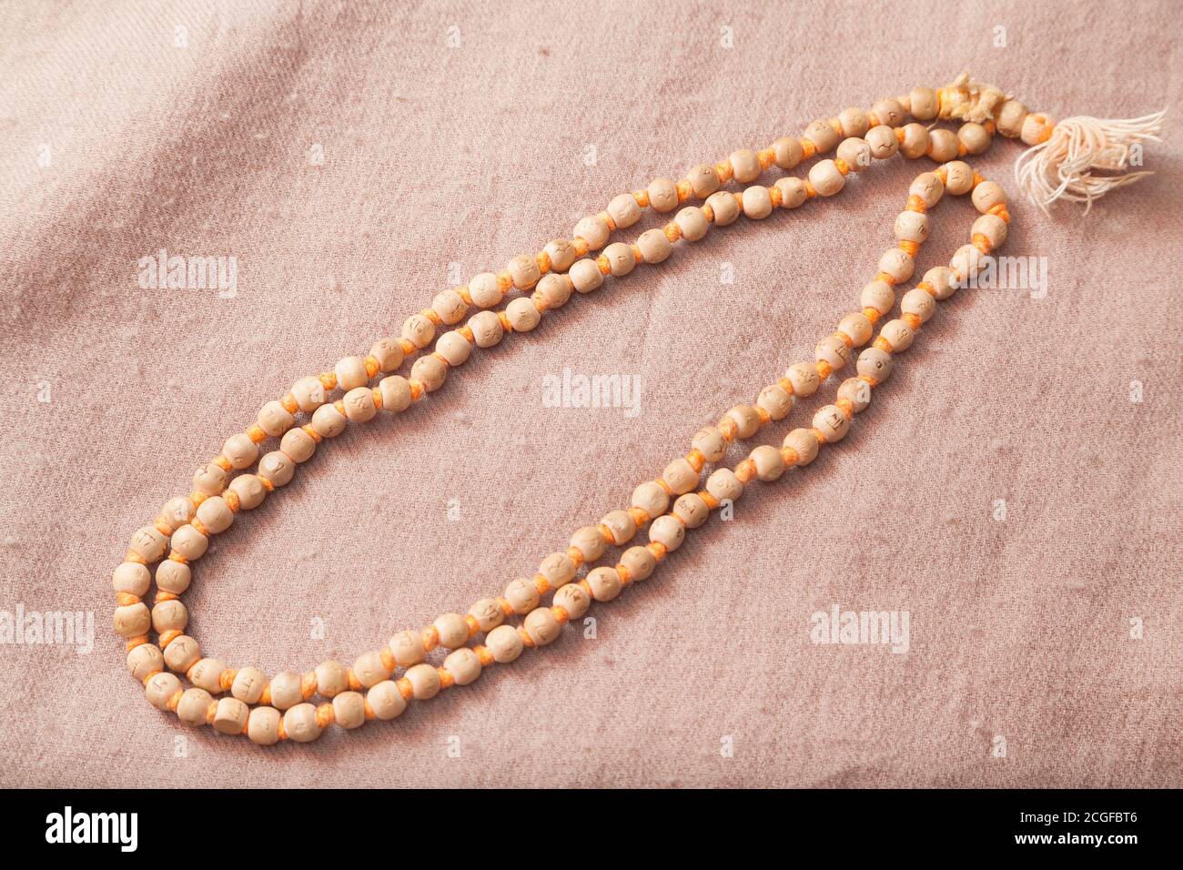 Traditional Indian japa mala chanting beads on woolen texture Stock ...