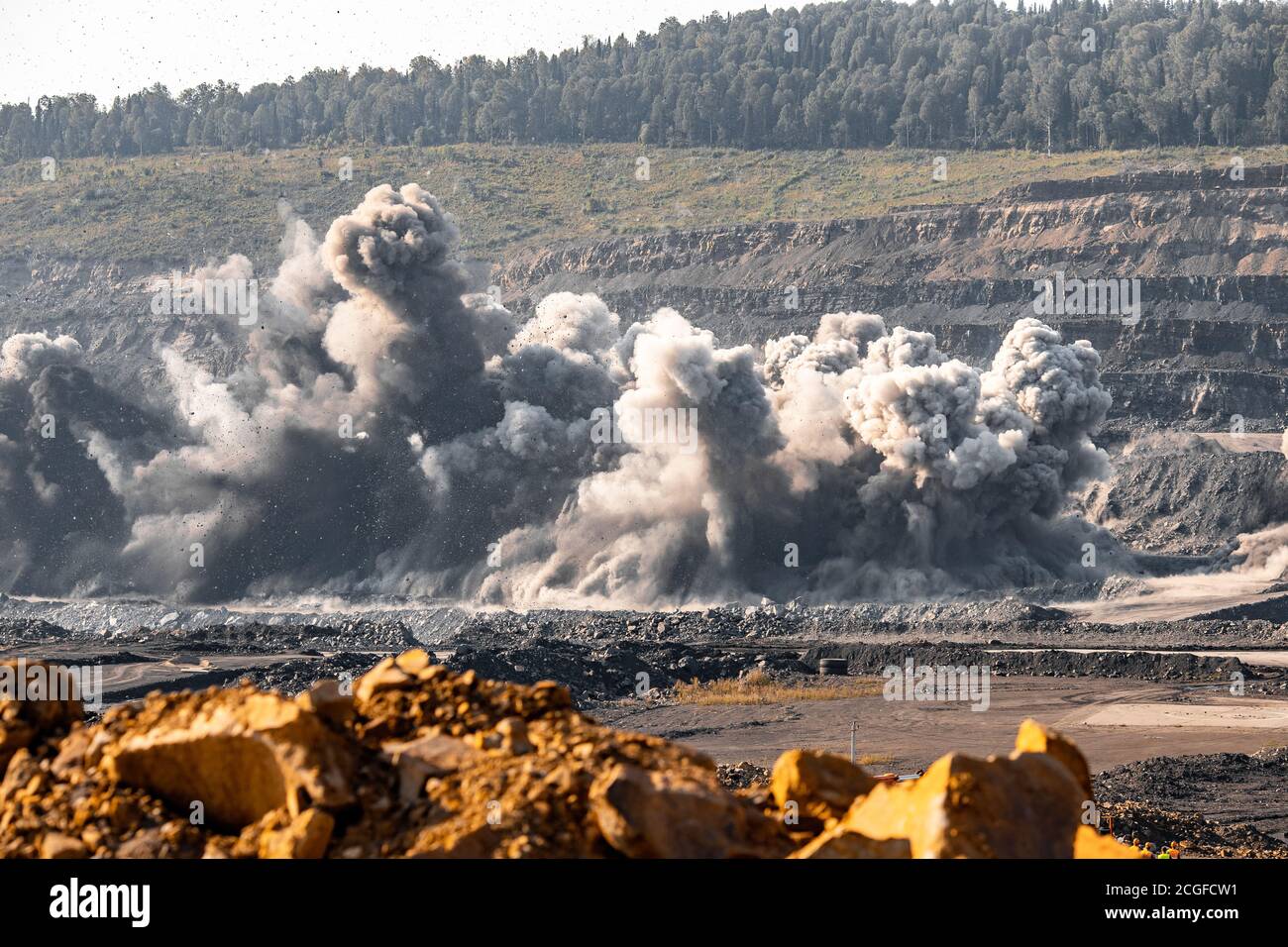 Explosive works on open pit coal mine industry Stock Photo - Alamy