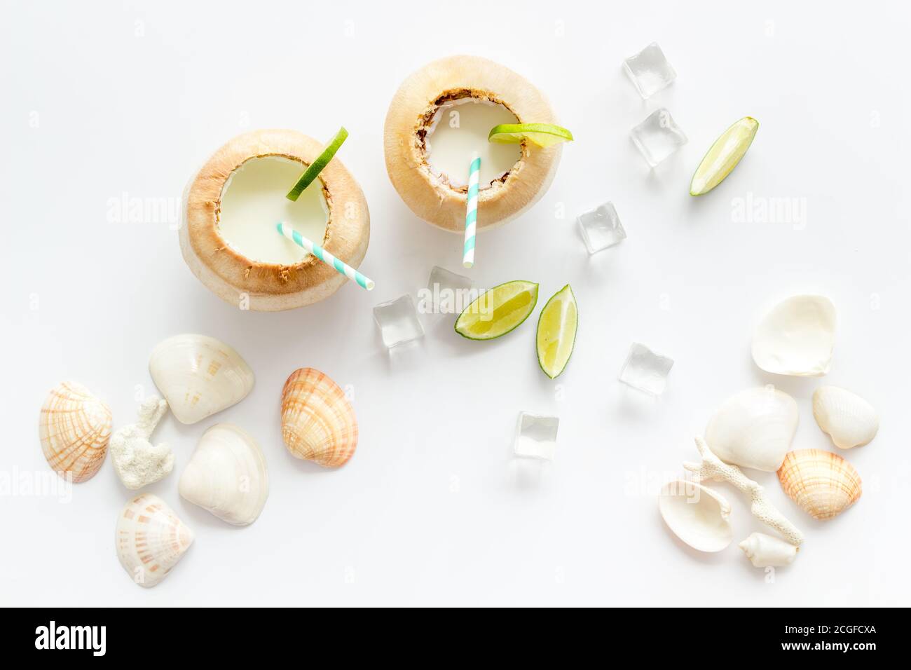 Young coconut water with straw on beach background, top view Stock ...