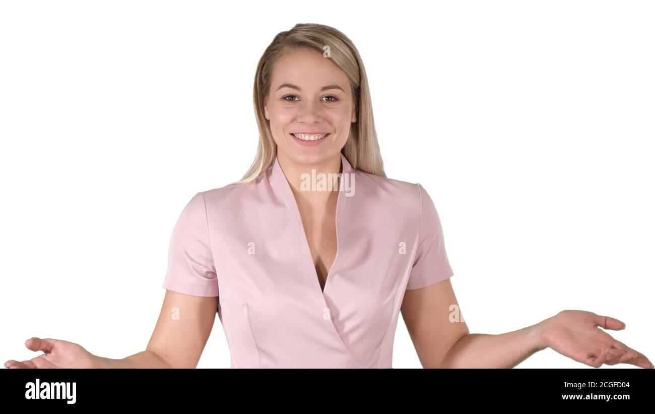 Woman in pink talking to the camera on white background Stock Photo - Alamy