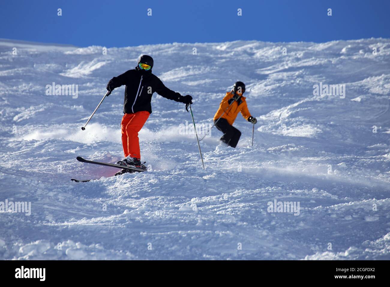 Sporty skier riding the slope Stock Photo - Alamy