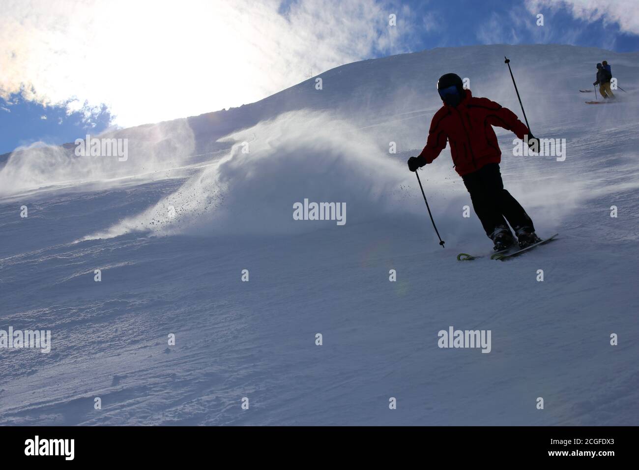 Sporty skier riding the slope Stock Photo - Alamy