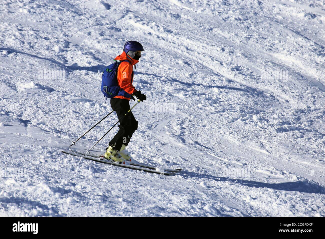 Sporty skier riding the slope Stock Photo - Alamy