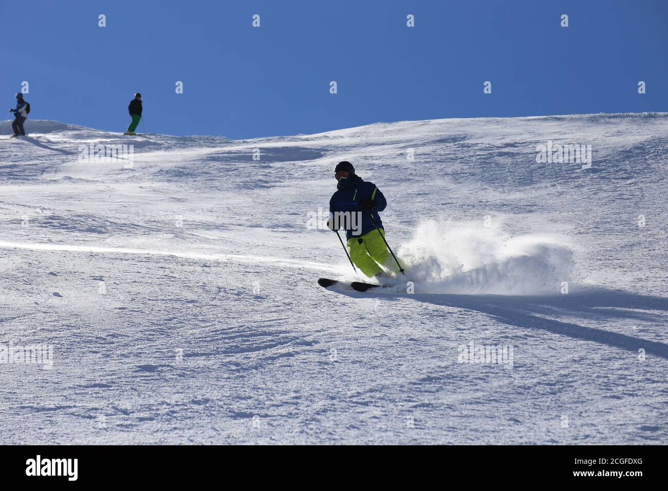 Sporty skier riding the slope Stock Photo - Alamy