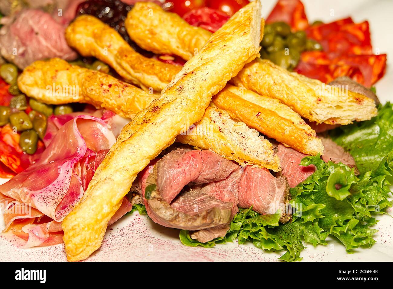 Meat plate antipasti in a restaurant. Party Platter of Assorted Cured ...