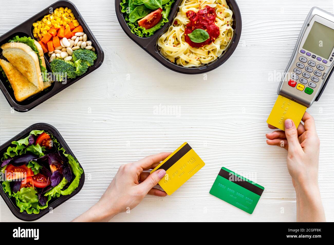 Hands with credit card and payment terminal. Restaurant food delivery ...