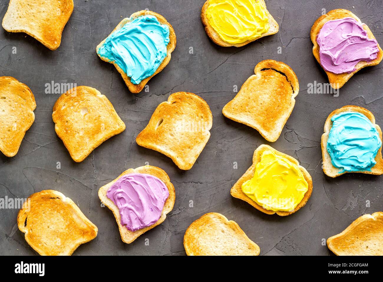Unicorn colored toast bread slices. Food background, top view Stock ...