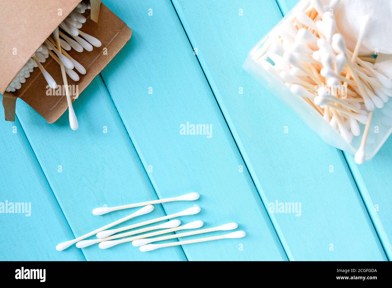 Eco wooden sticks in a box. Cotton pads for hygiene Stock Photo - Alamy
