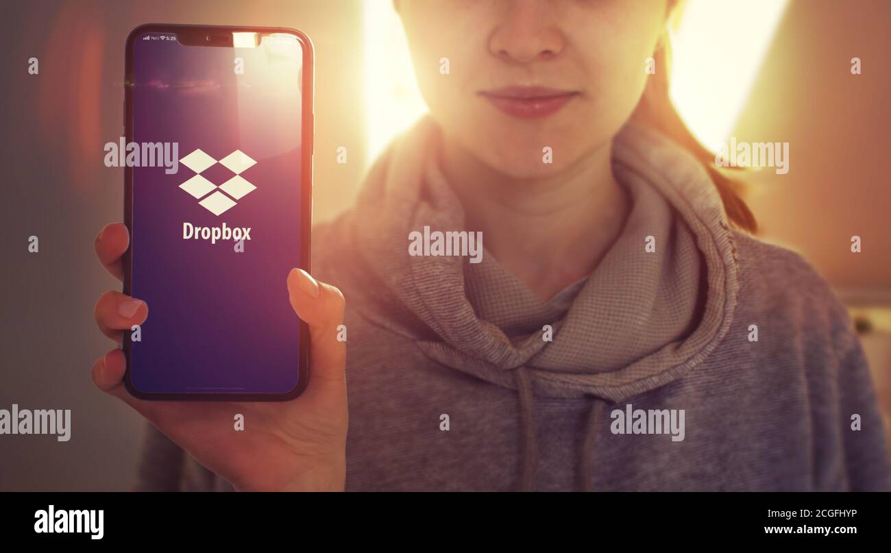 KYIV, UKRAINE-JANUARY, 2020: Dropbox on Smart Phone Screen. Young Girl ...