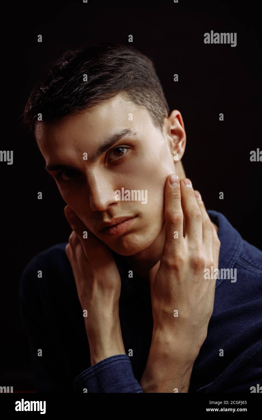 Portrait of good-looking serious man with healthy clean skin looking at ...