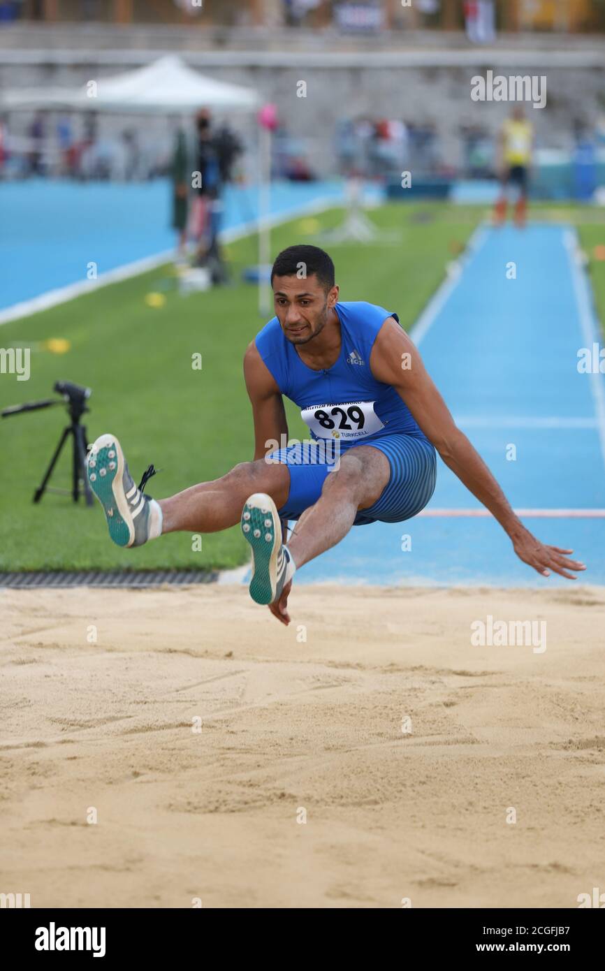 ISTANBUL, TURKEY - SEPTEMBER 04, 2020: Undefined athlete long jumping ...