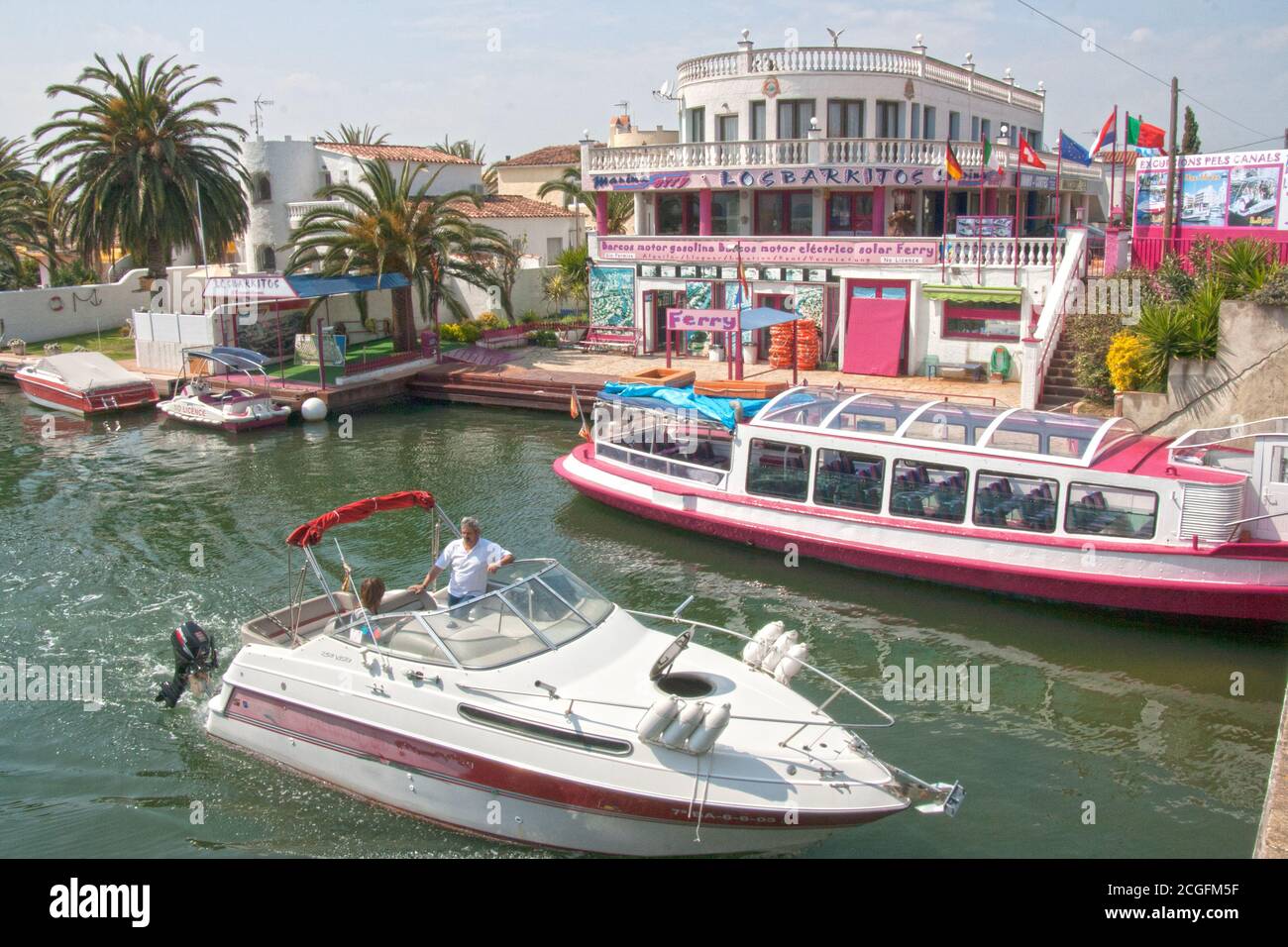 The pink is the dominant color in this port. Small and large boats, the ...
