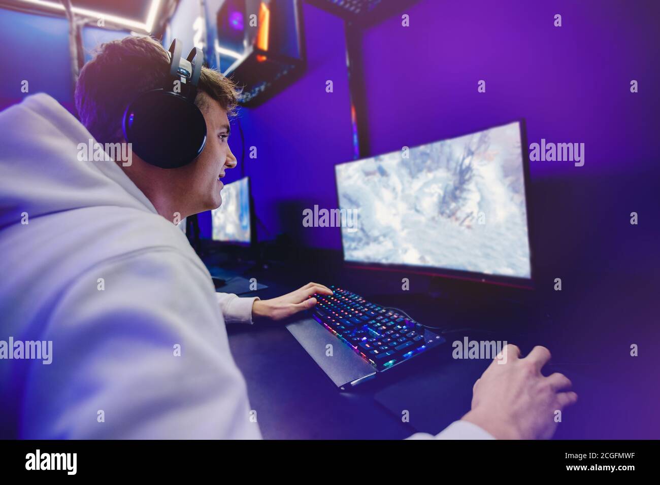 Professional gamer playing tournaments online video games computer with ...
