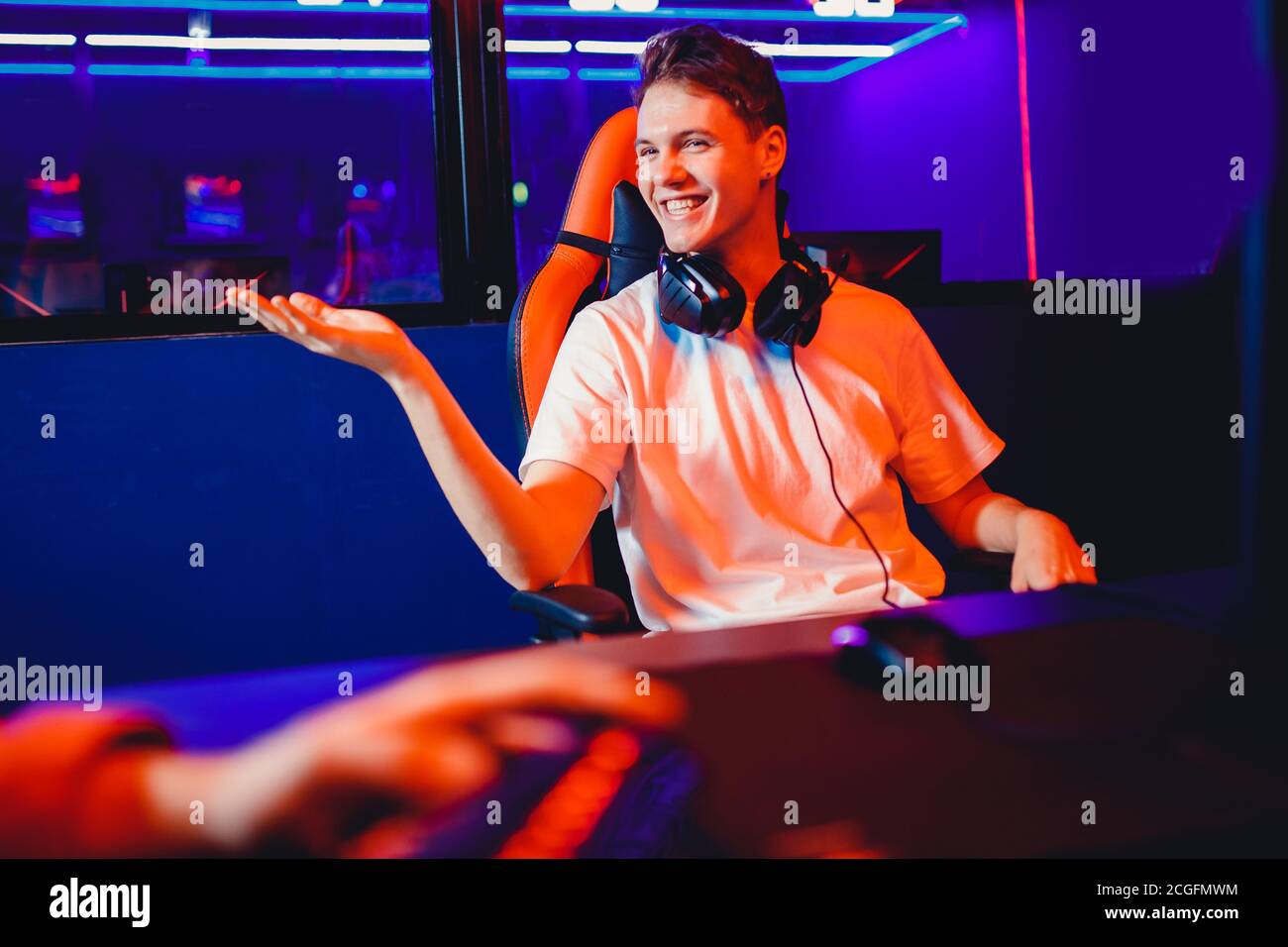 Streamer young man rejoices in victory professional gamer playing ...