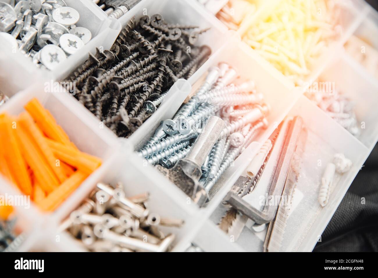 Case with small construction objects. Set metal tool box of screws ...