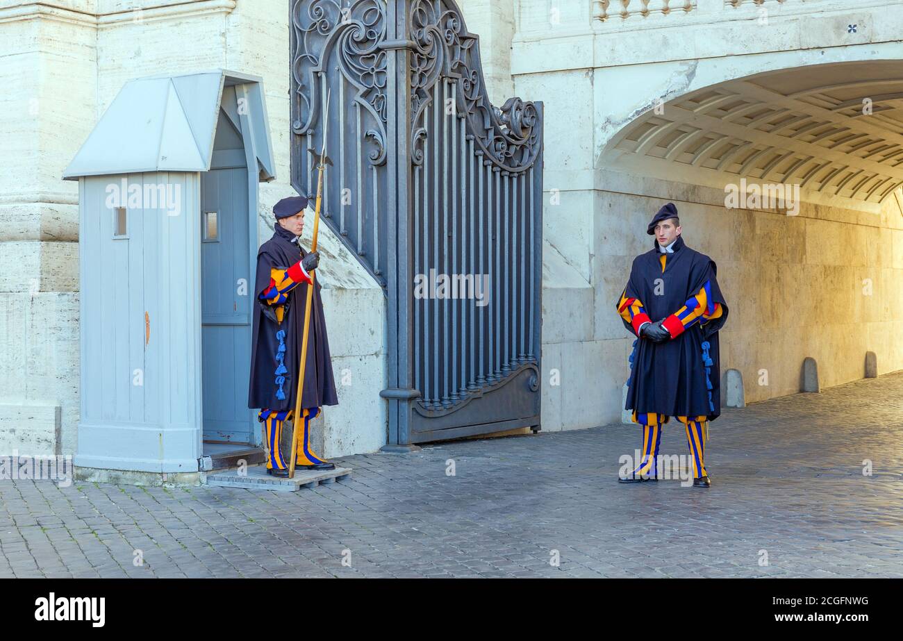 The Pontifical Swiss Guard guarding the entrance to the Vatican City ...