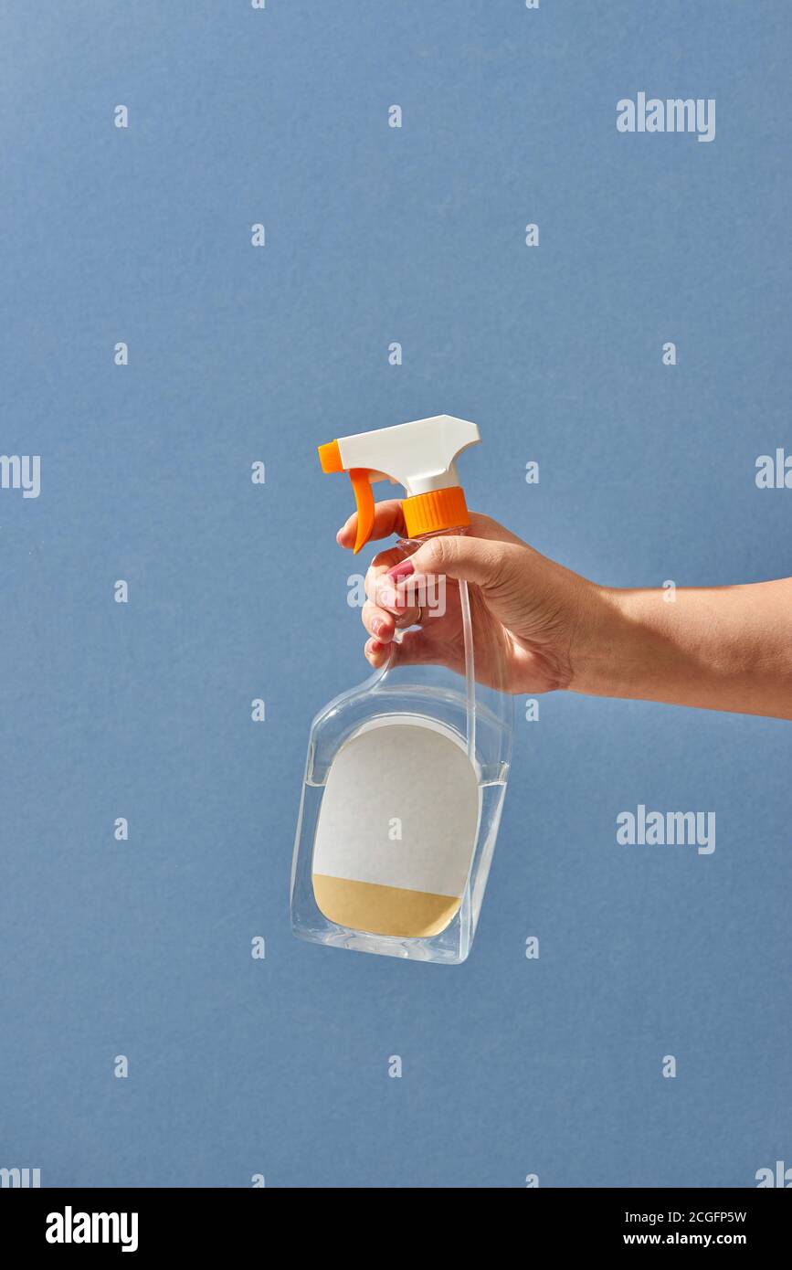 Sanitation worker spray cleaning agent Stock Photo - Alamy