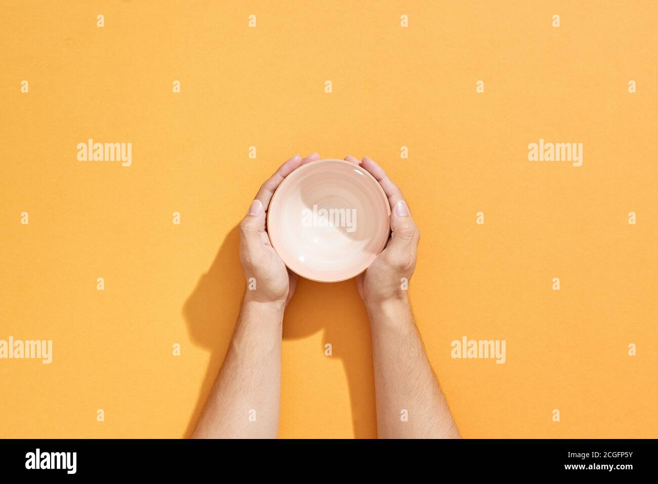 Man holds empty bowl hi-res stock photography and images - Alamy