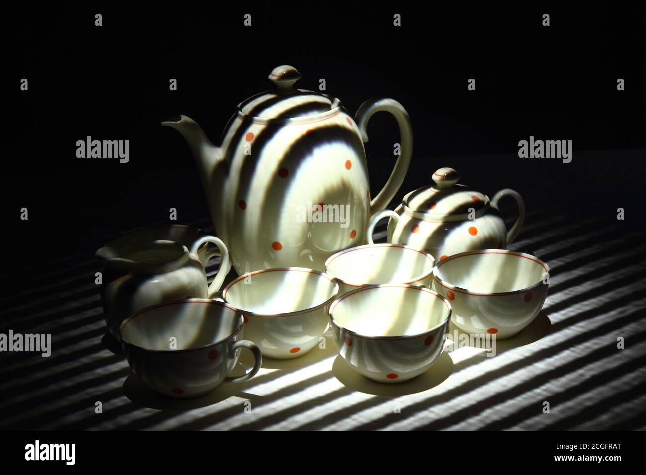 porcelain in the dark night (white light effect Stock Photo - Alamy