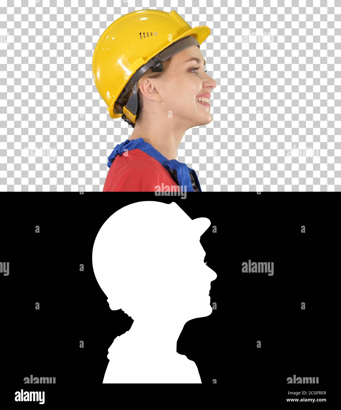 The young woman engineer with yellow safety helmet walking and smiling ...