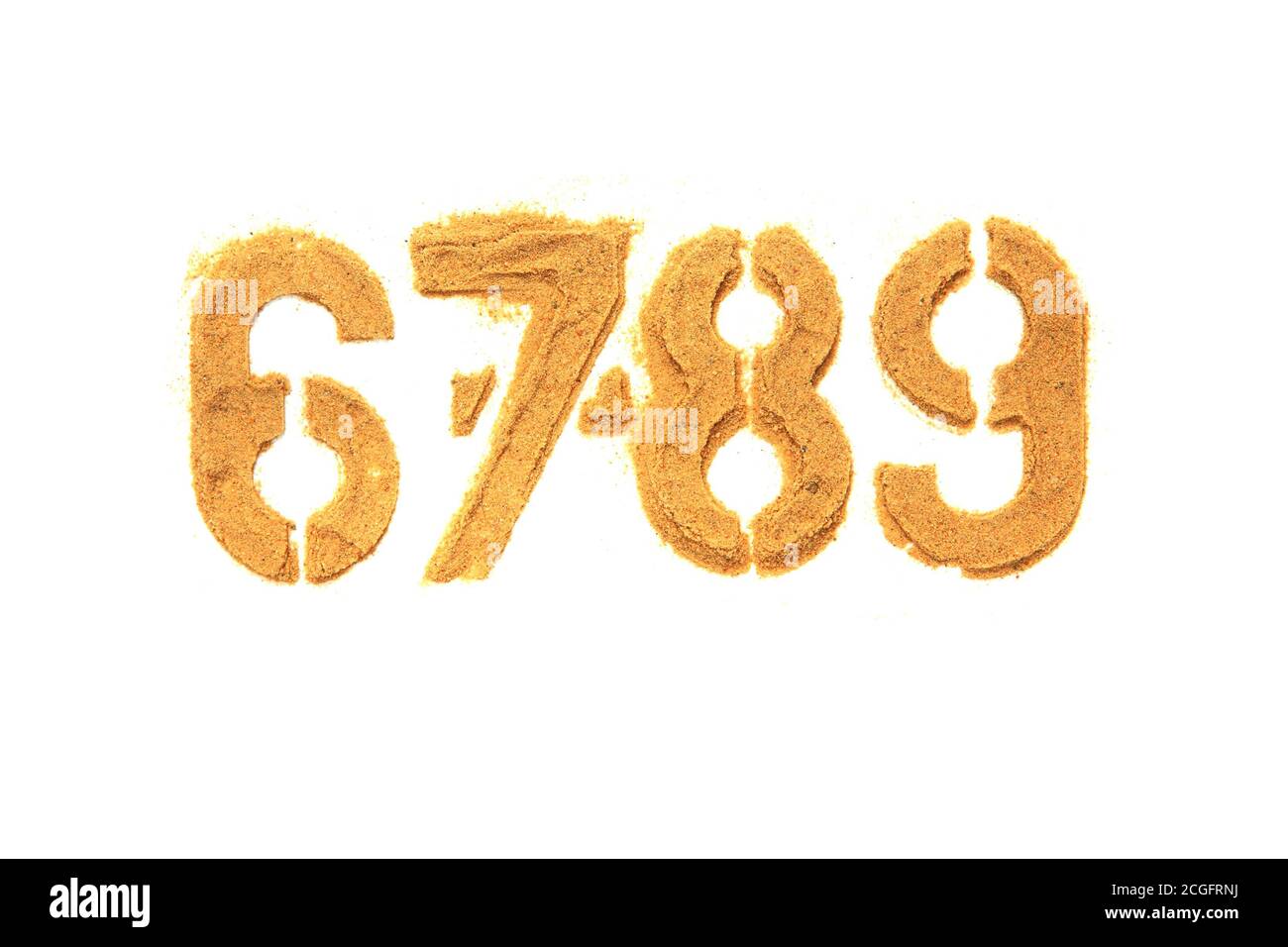 alphabet and numbers from the sand isolated on the white background ...