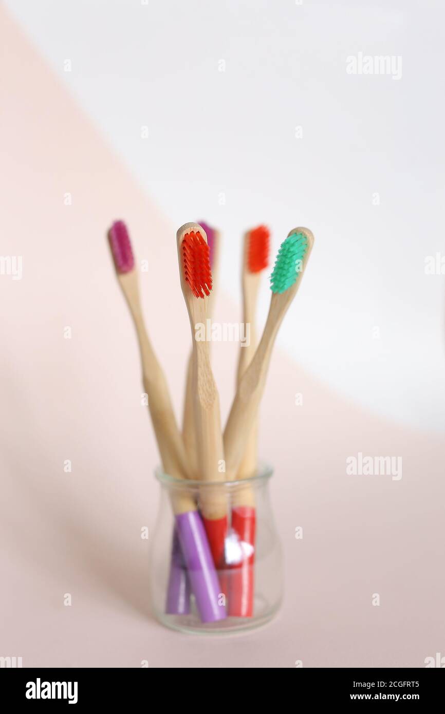 Family set of ecological four wooden toothbrushes with colorful bristle ...