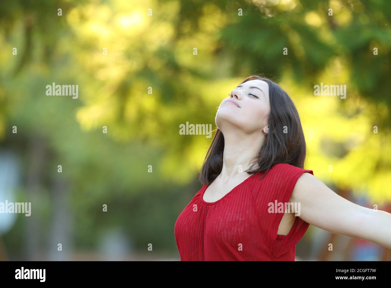 Happy relaxed woman outside hi-res stock photography and images - Alamy