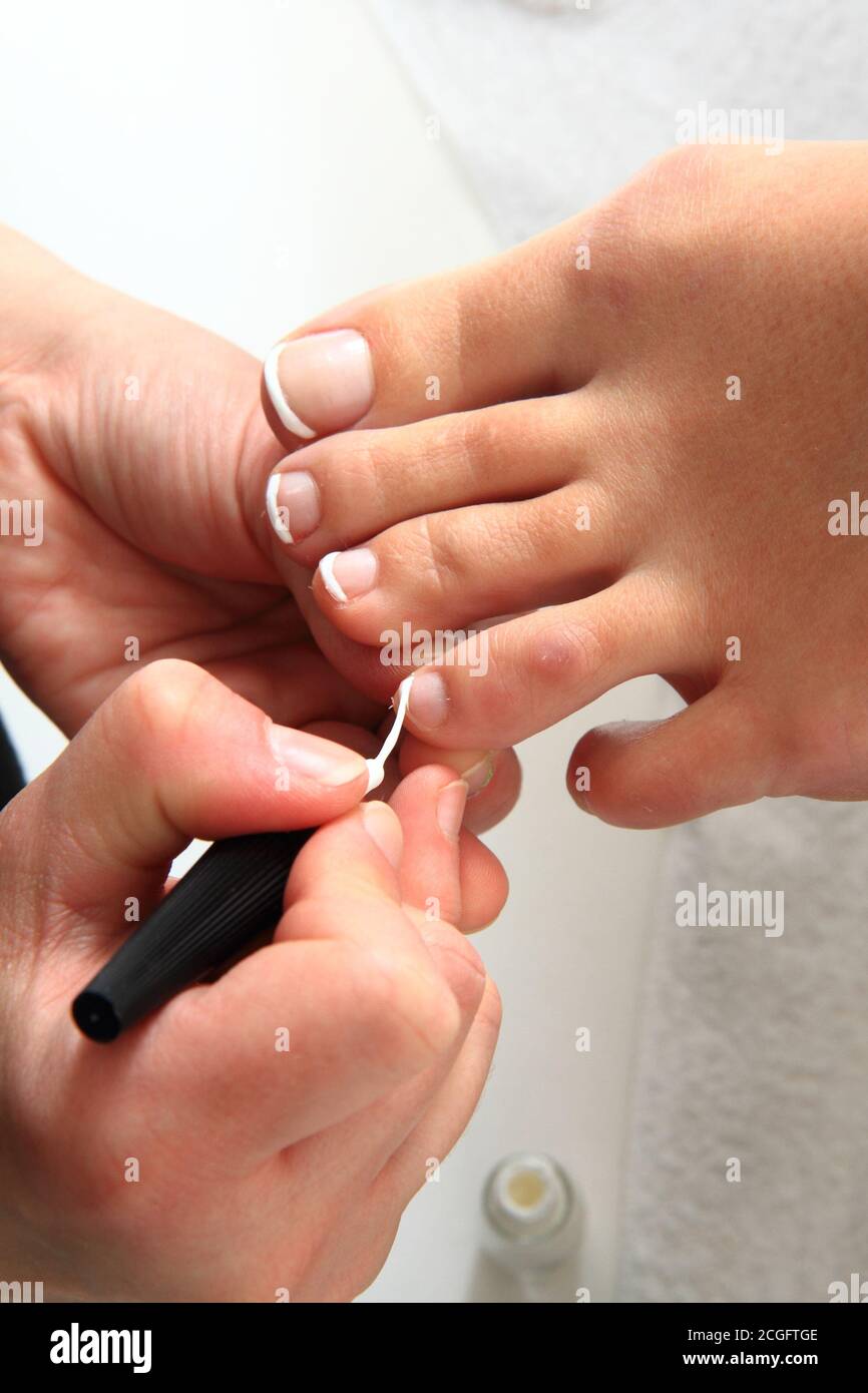 Red nails on legs hi-res stock photography and images - Alamy