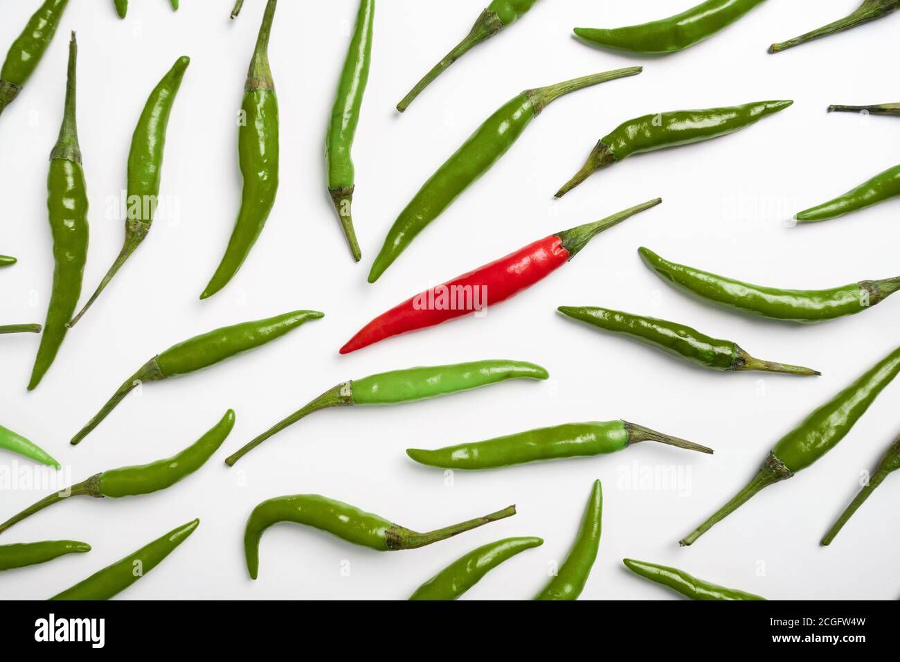 Red and green chilli peppers on a white background Stock Photo - Alamy