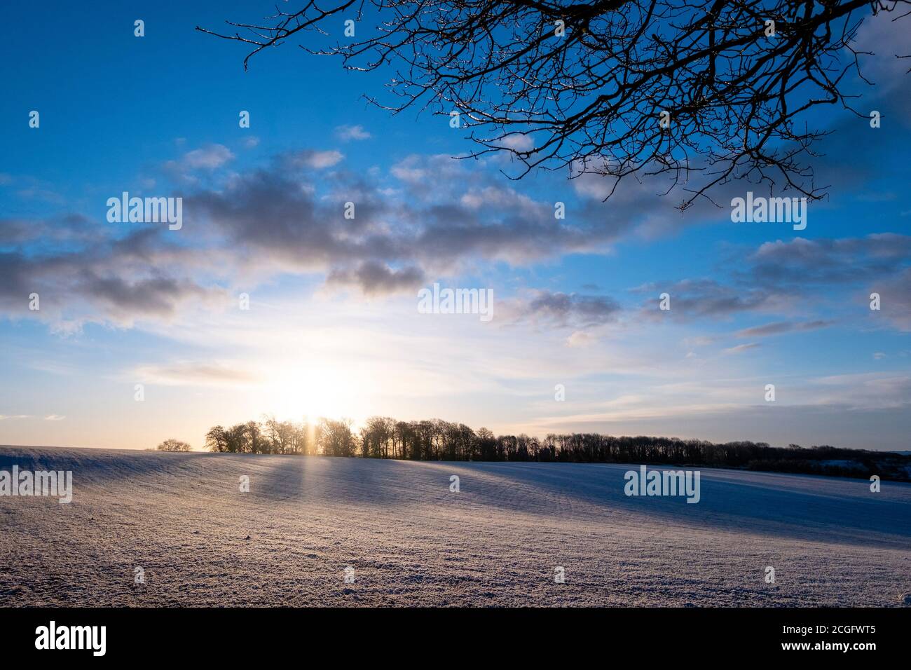A bright winter morning with deep blue sky and rolling hills adn ...