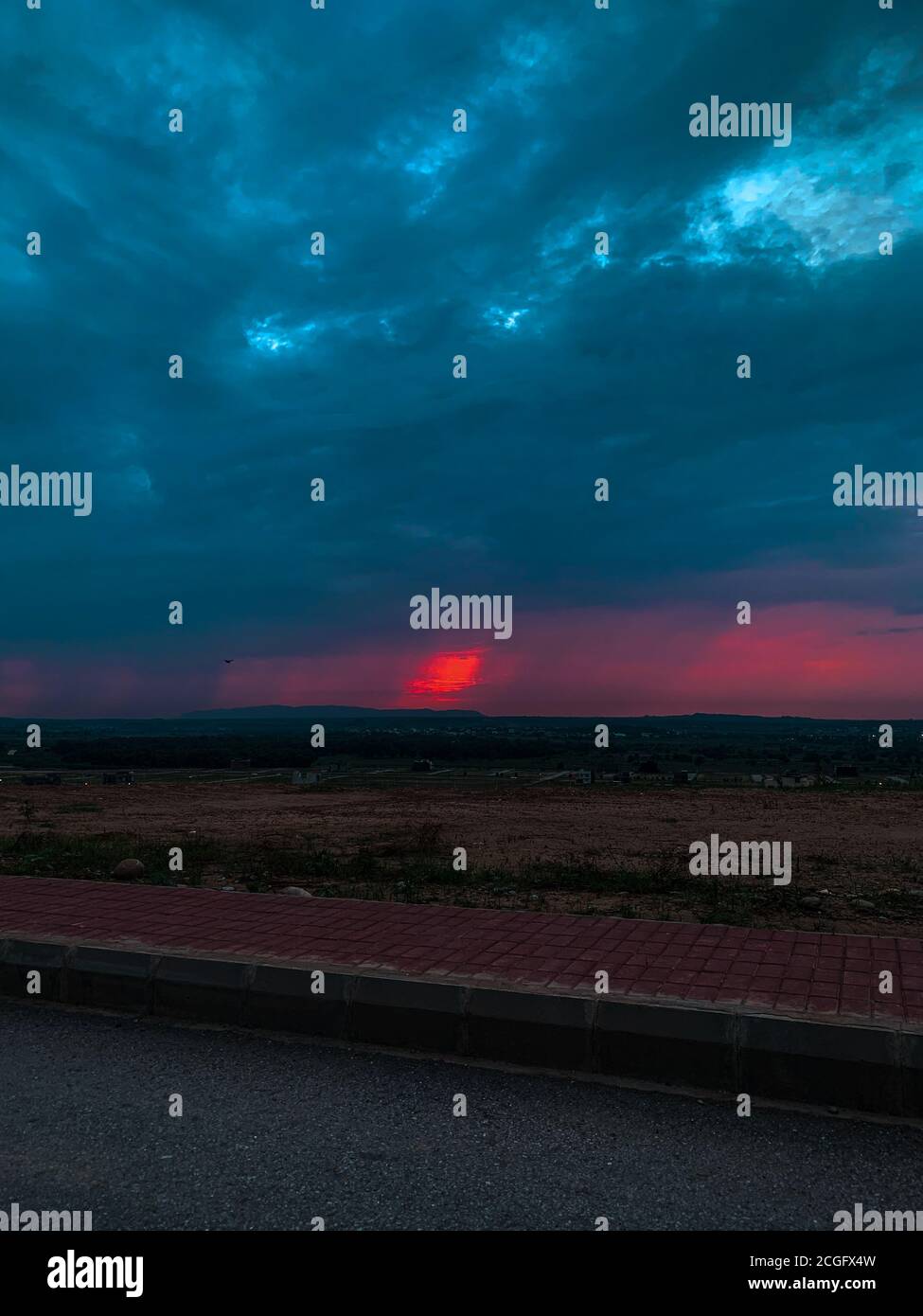 Sunset on rainy evening Stock Photo - Alamy