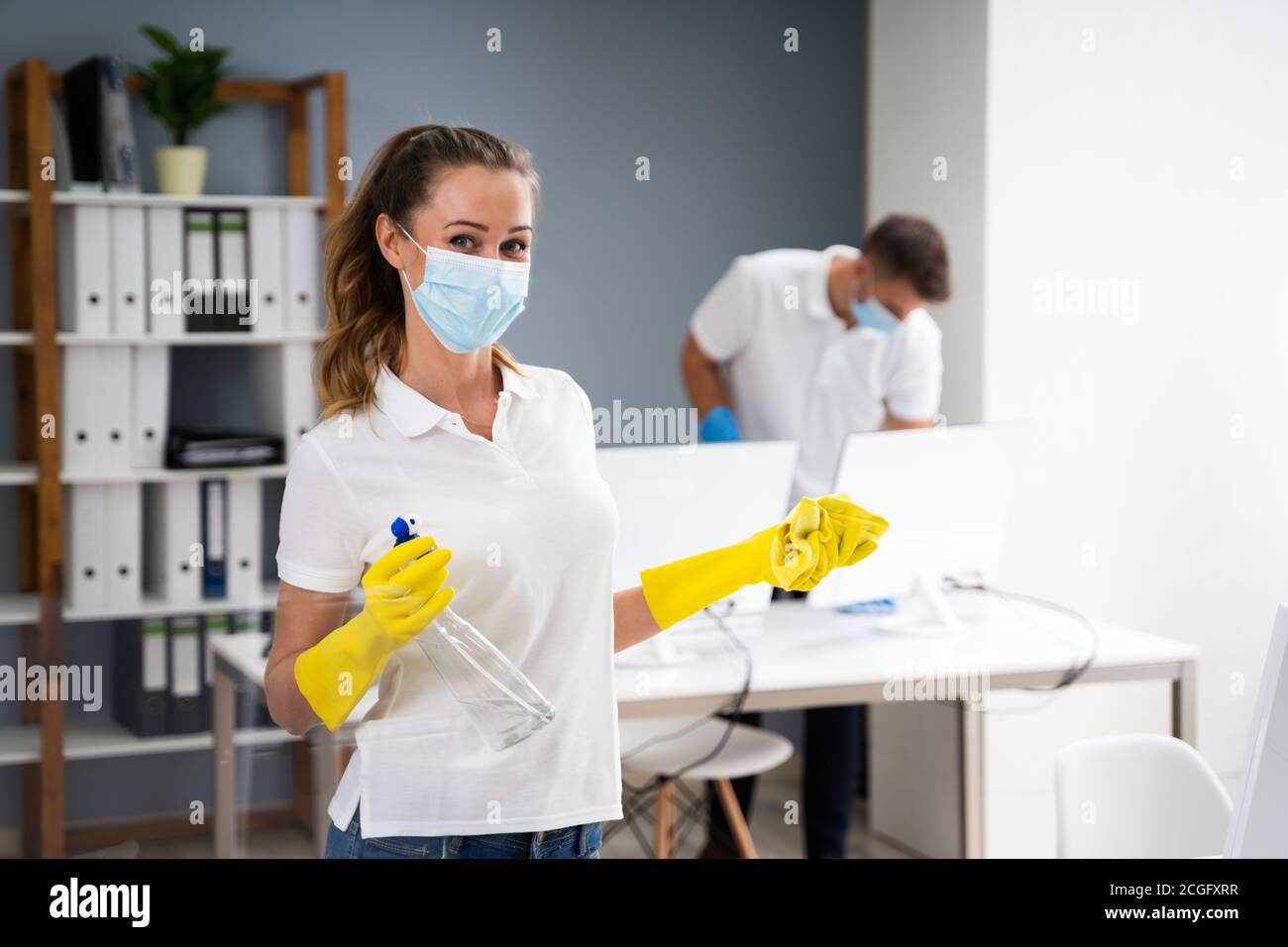 Workplace Cleaning Service Janitor Standing In Office Wearing Face Mask ...