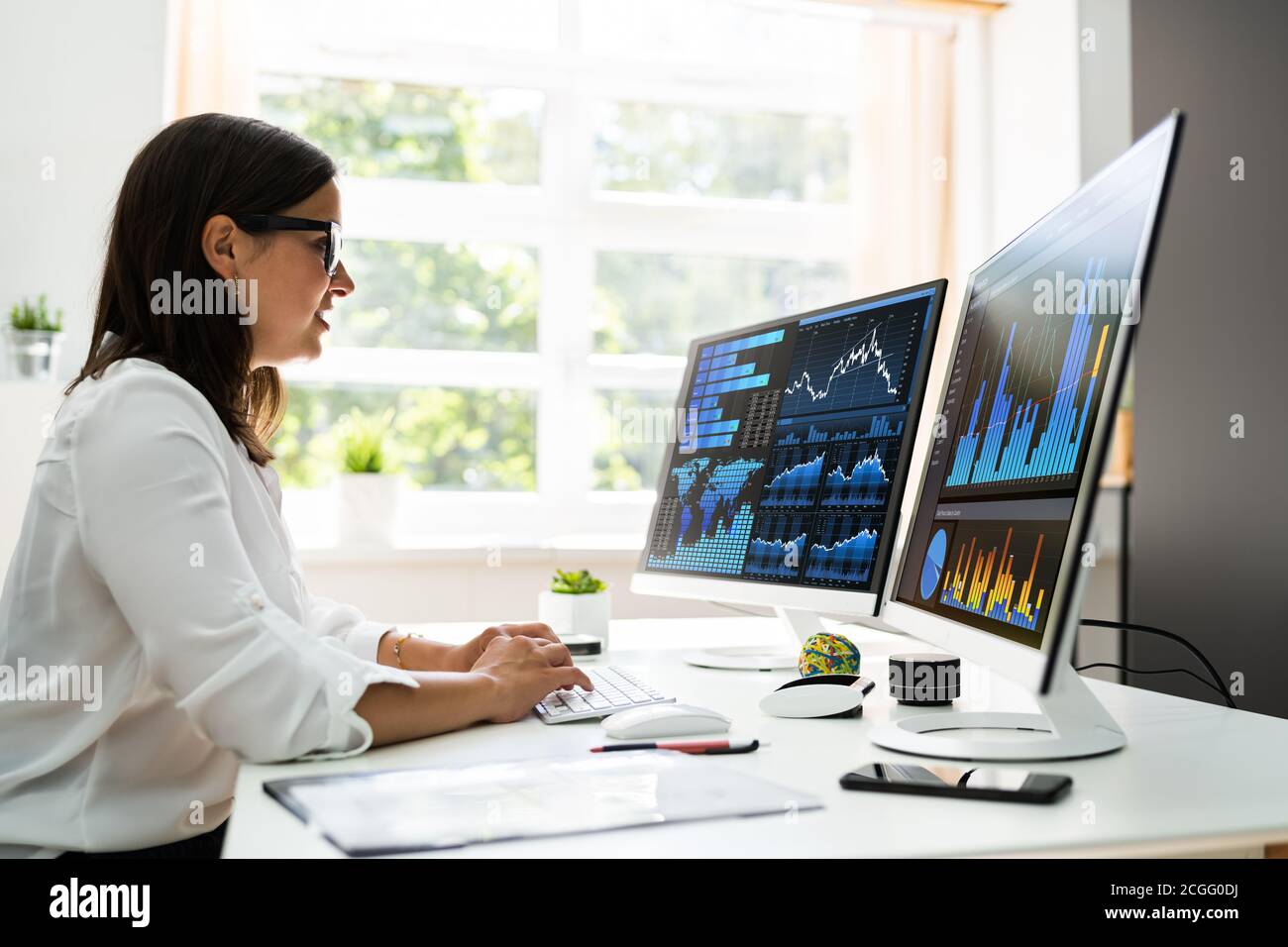 Analyst Women Looking At KPI Data On Computer Screen Stock Photo - Alamy