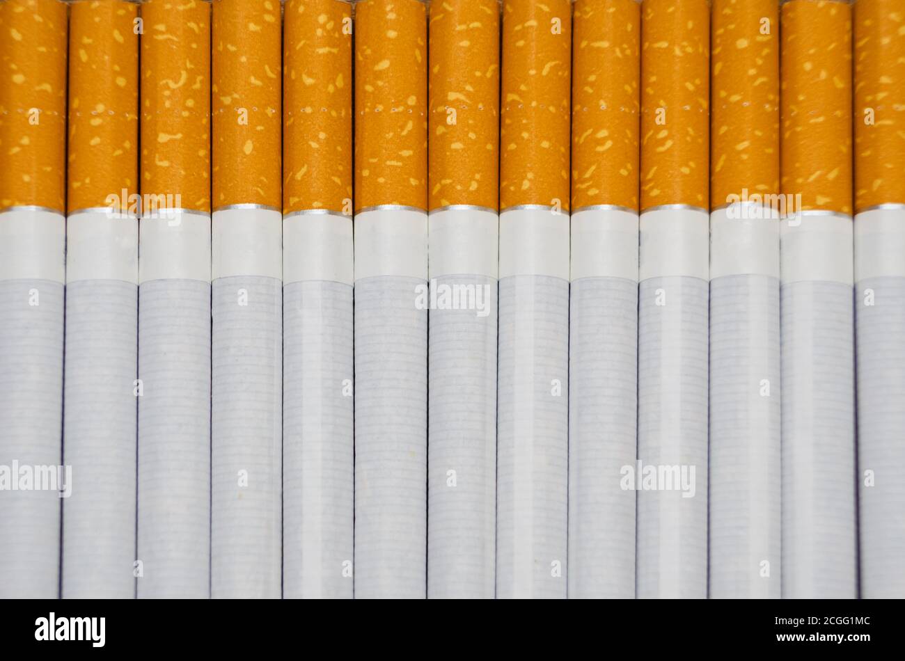 Horizontal background from a number of cigarettes Stock Photo - Alamy
