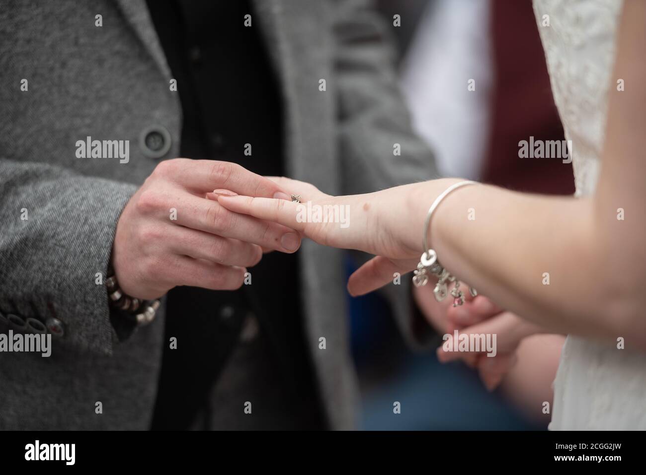 Wedding Ring Exchange Groom to Bride Stock Photo - Alamy