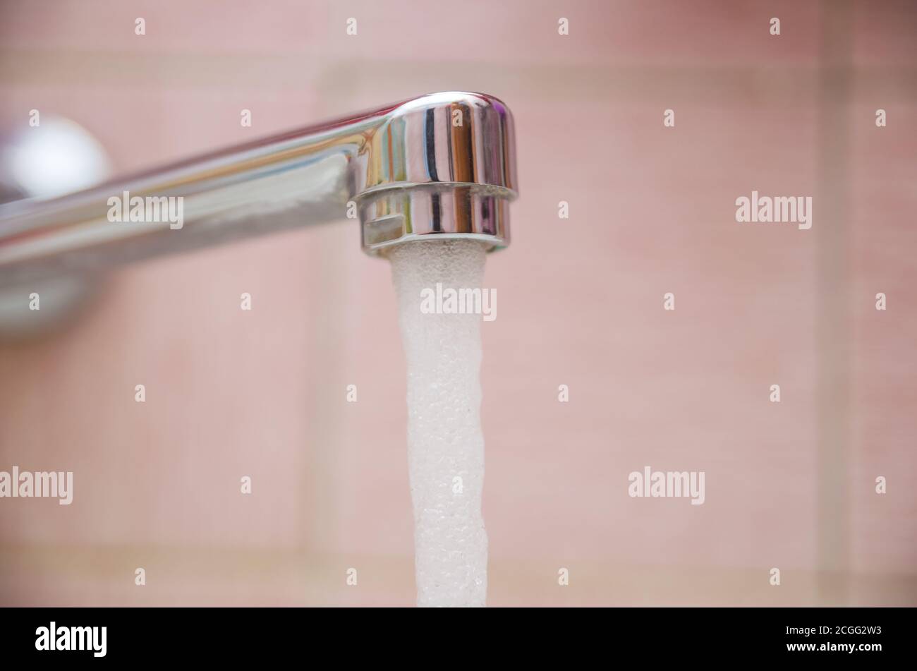A large flow of water from the tap Stock Photo - Alamy