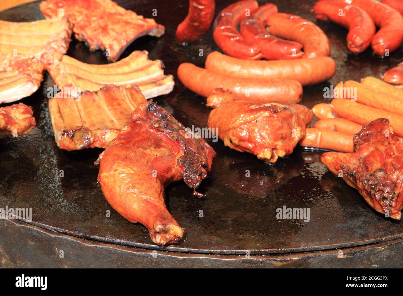 different grilled meat as very nice food background Stock Photo - Alamy