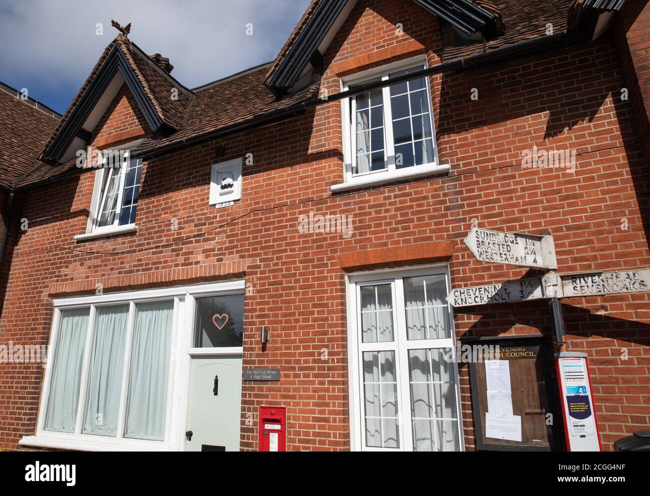 A charming house with a road direction sign outside in Chipstead, Kent ...