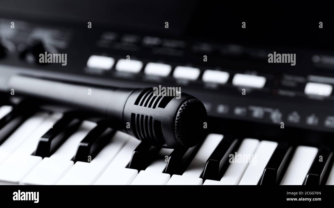Microphone on keyboard . Close up Stock Photo - Alamy