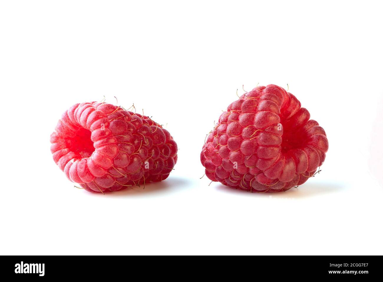 Two ripe raspberry fruits isolated on white background Stock Photo - Alamy
