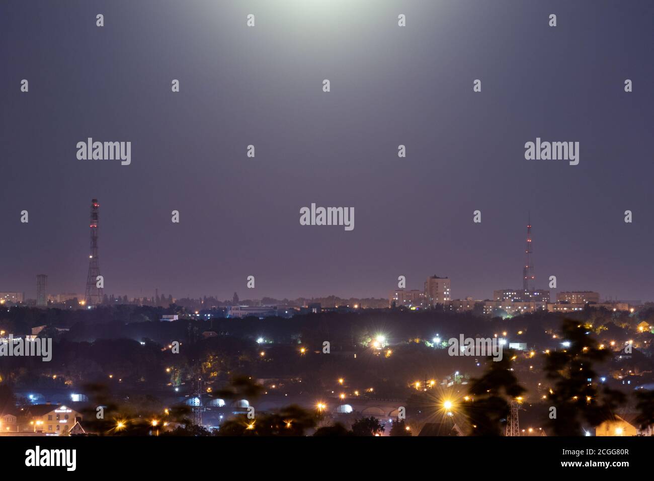 Night time city lights panorama in purple romantic colors. Big city ...