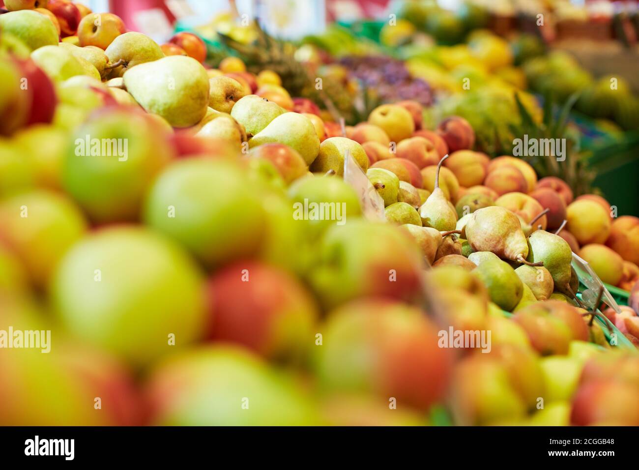 Fresh fruit selection with pears, apples and peaches in the supermarket ...