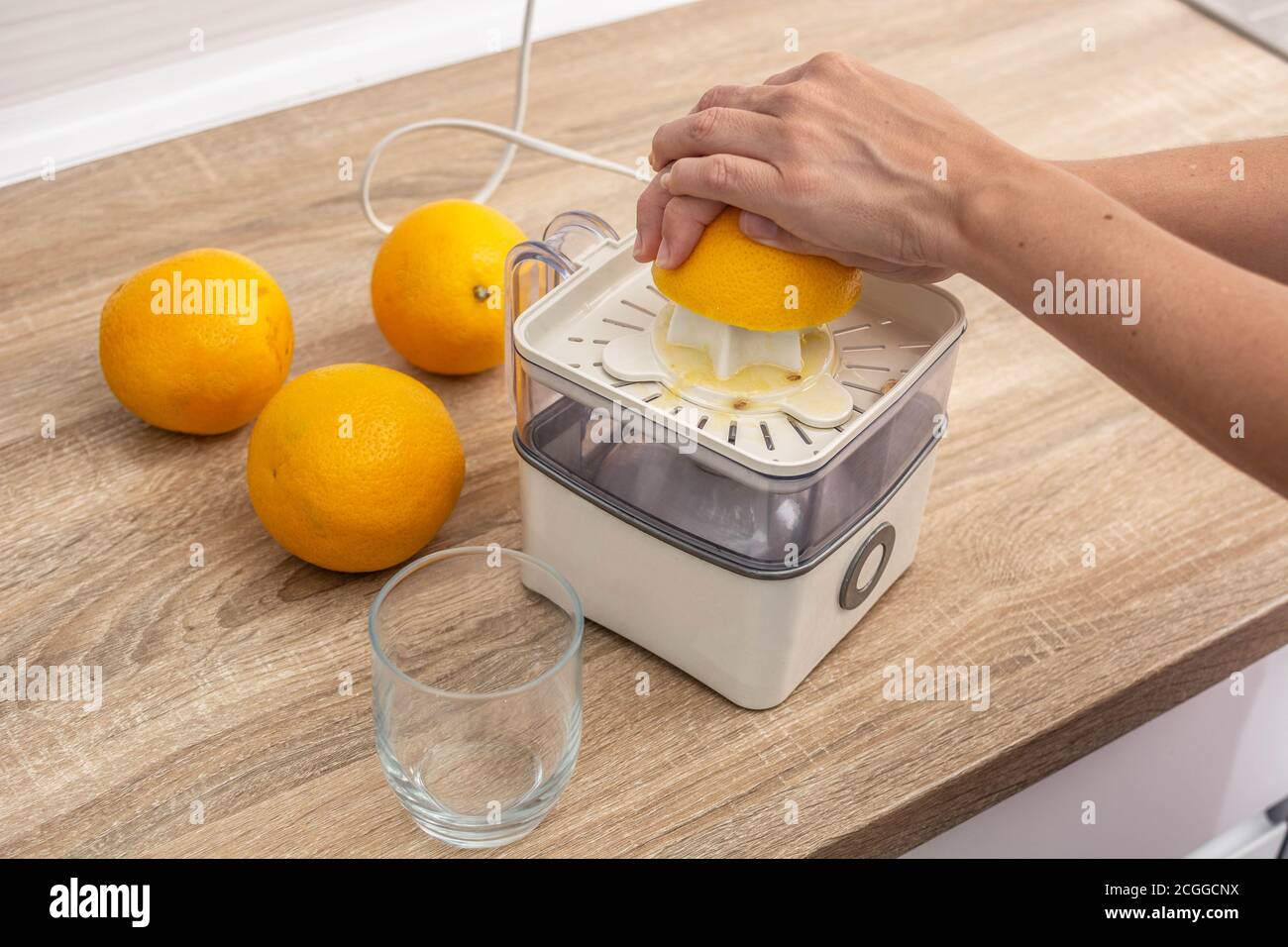Hand squeezing food hi-res stock photography and images - Alamy