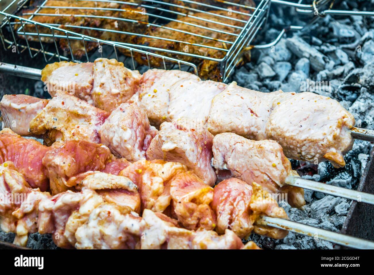 grilled meat on the charcoal grill. Embers smoke ash Stock Photo - Alamy