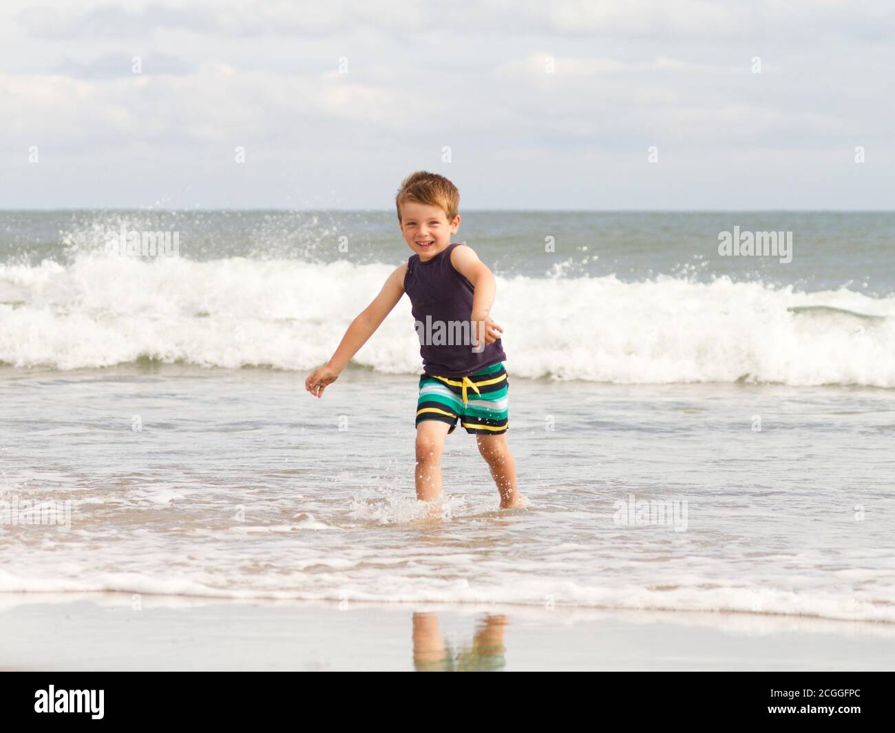 boy at the beach Stock Photo - Alamy