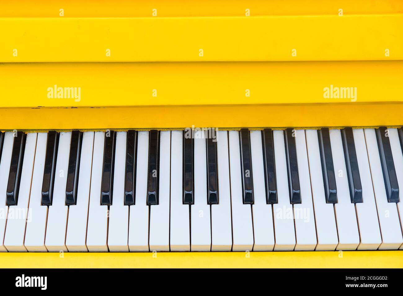 Panel with yellow piano keys with top view Stock Photo - Alamy